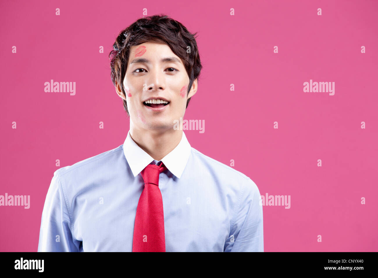 A man with red lip print on his cheeks Stock Photo - Alamy