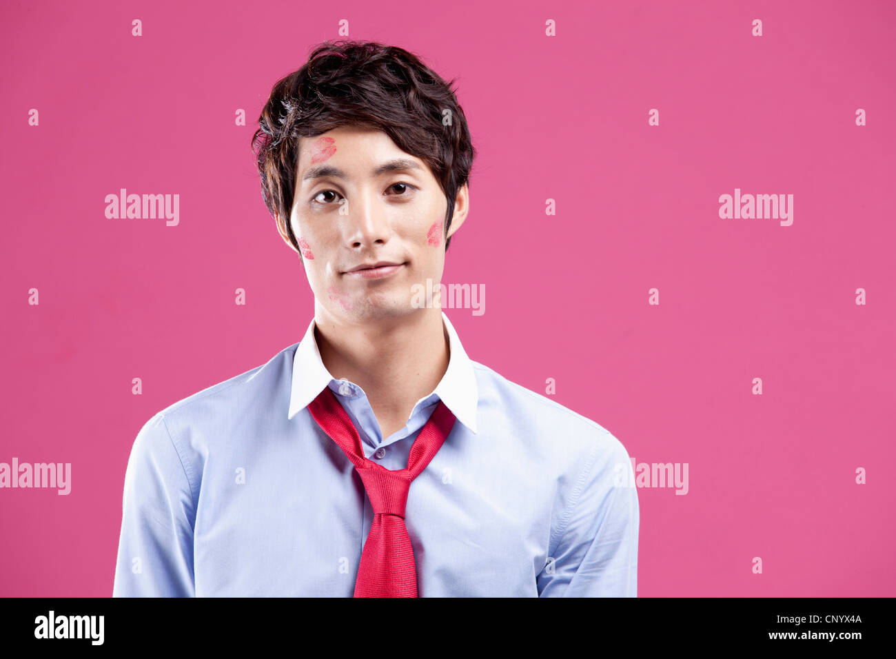 A man with red lip print on his cheeks Stock Photo - Alamy