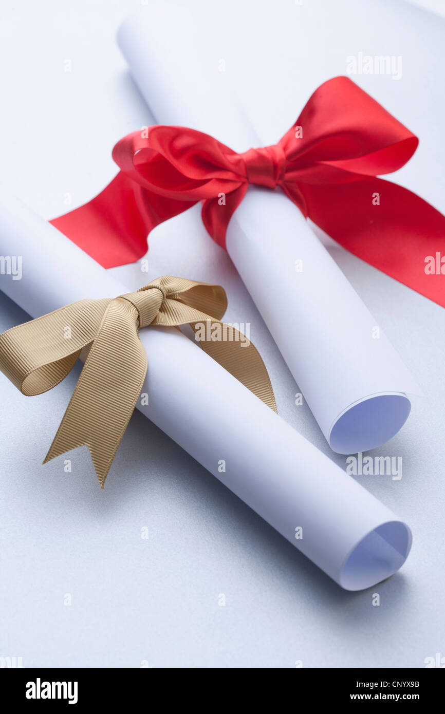 The diploma with gold and red ribbon Stock Photo - Alamy