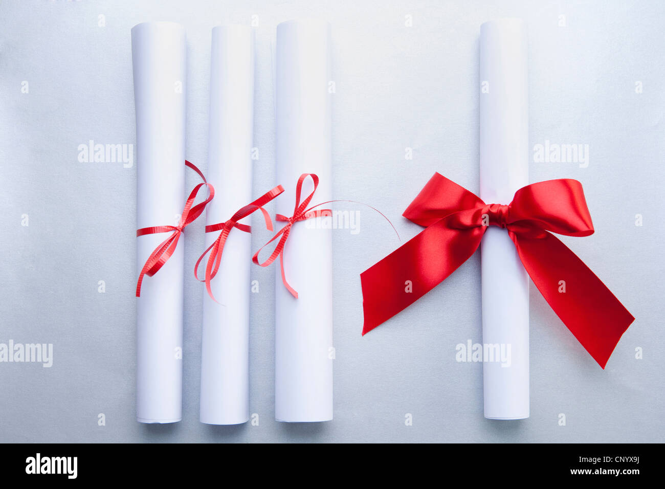 The diploma with red ribbon Stock Photo - Alamy