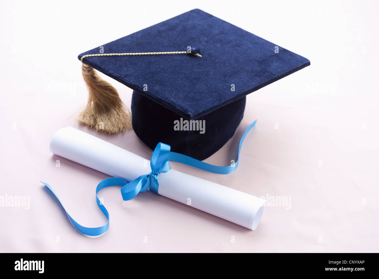 The graduation cap and the diploma Stock Photo - Alamy