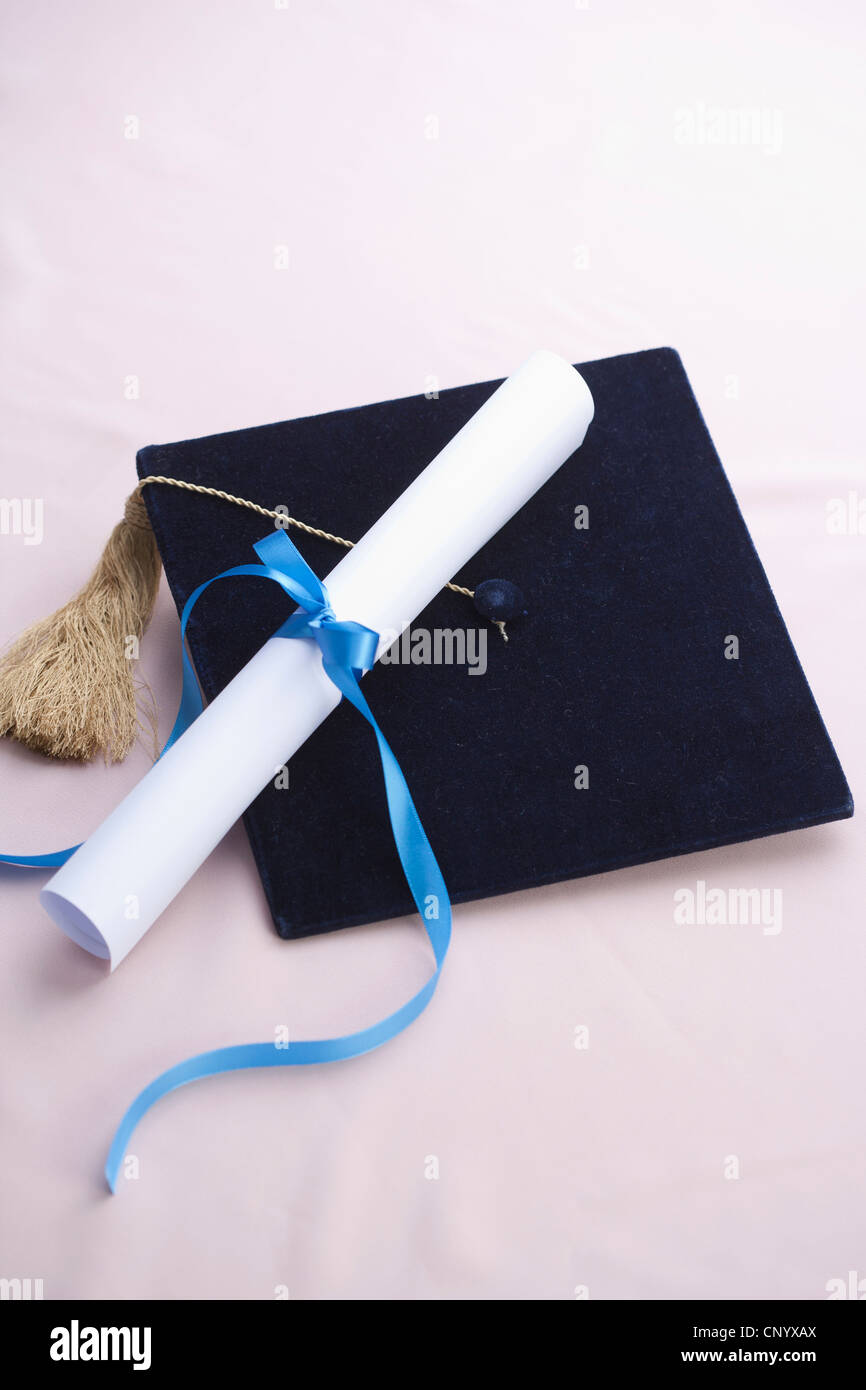 The graduation cap and the diploma Stock Photo - Alamy