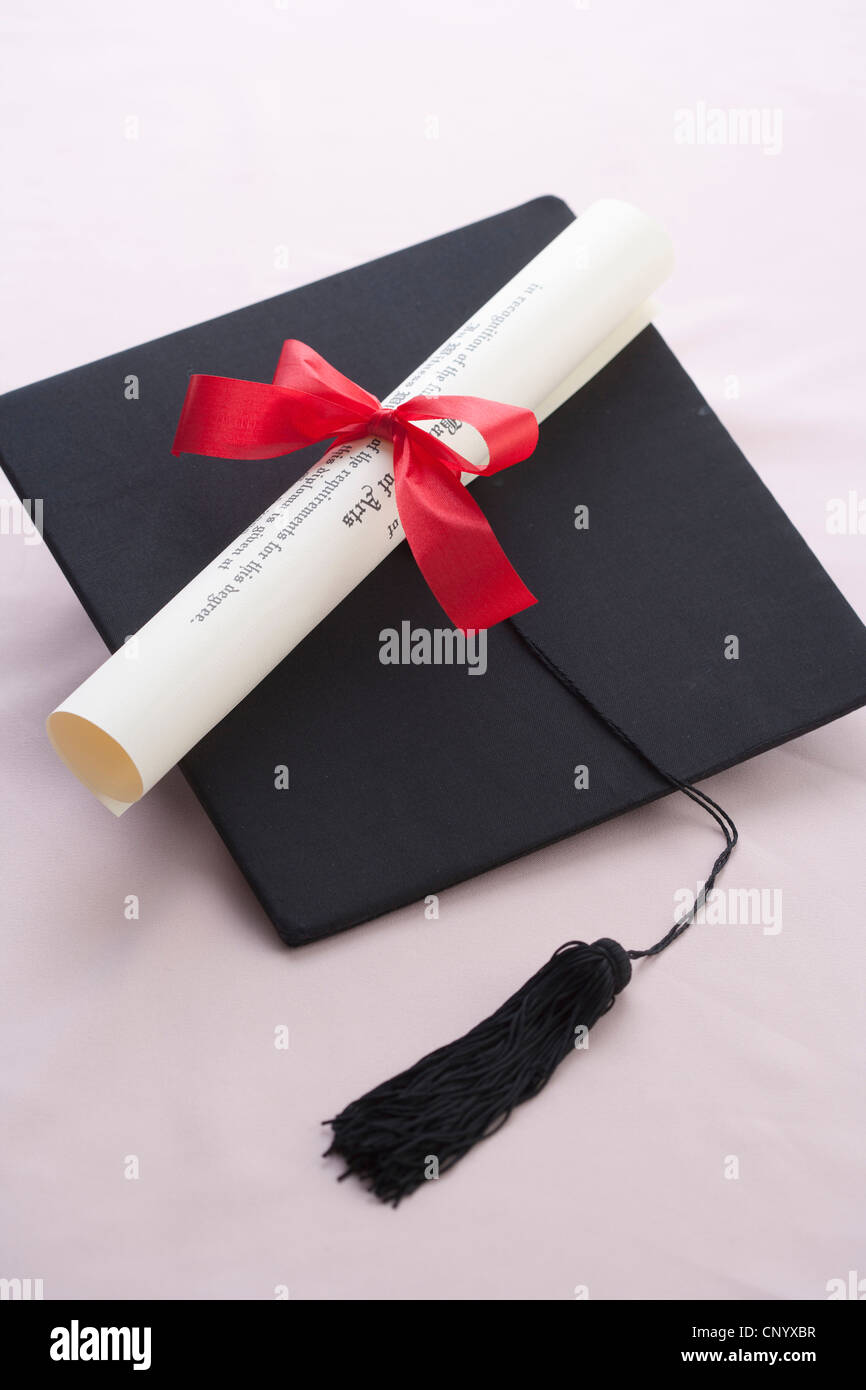 The graduation cap and the diploma Stock Photo - Alamy