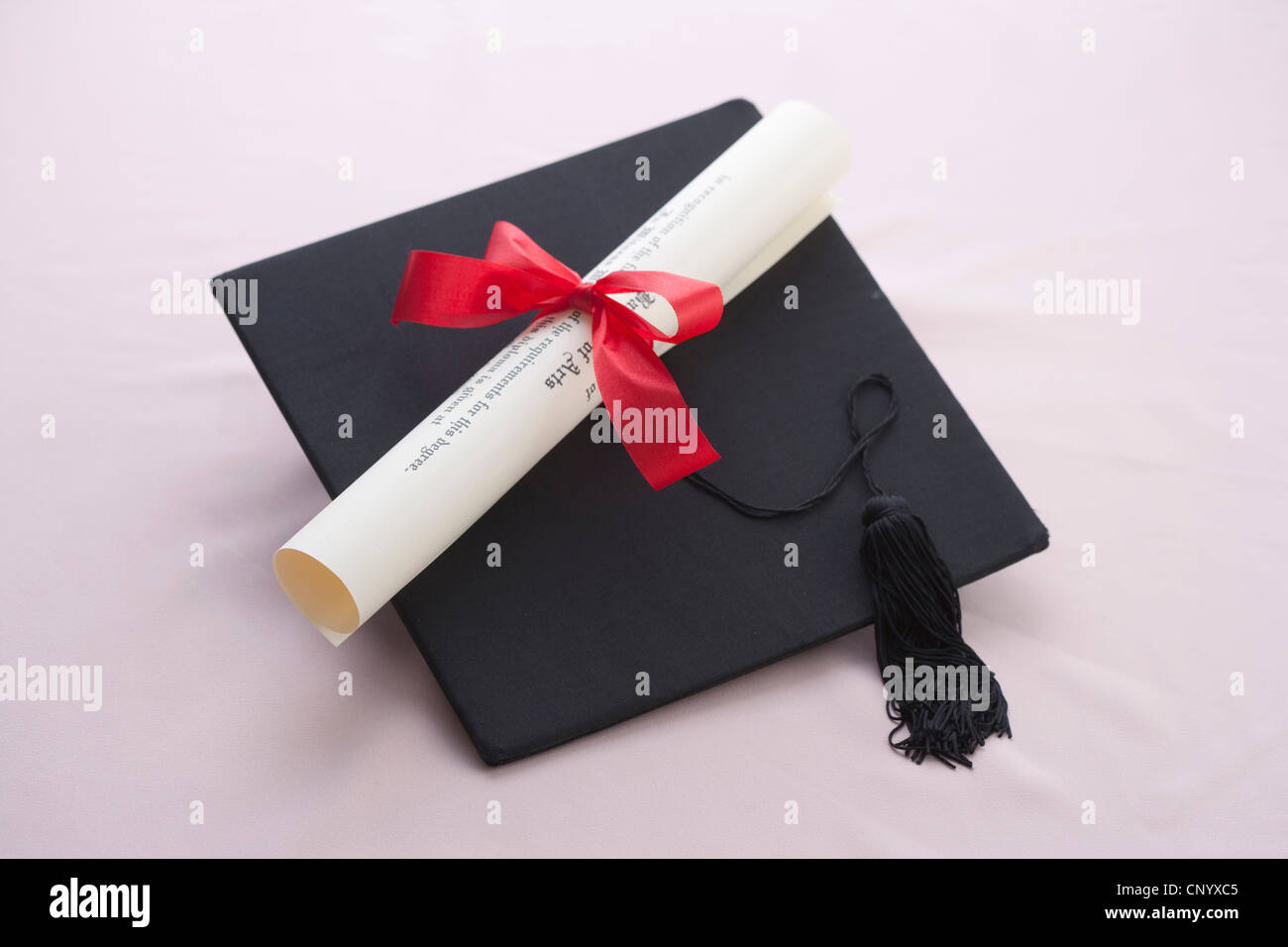 The graduation cap and the diploma Stock Photo - Alamy