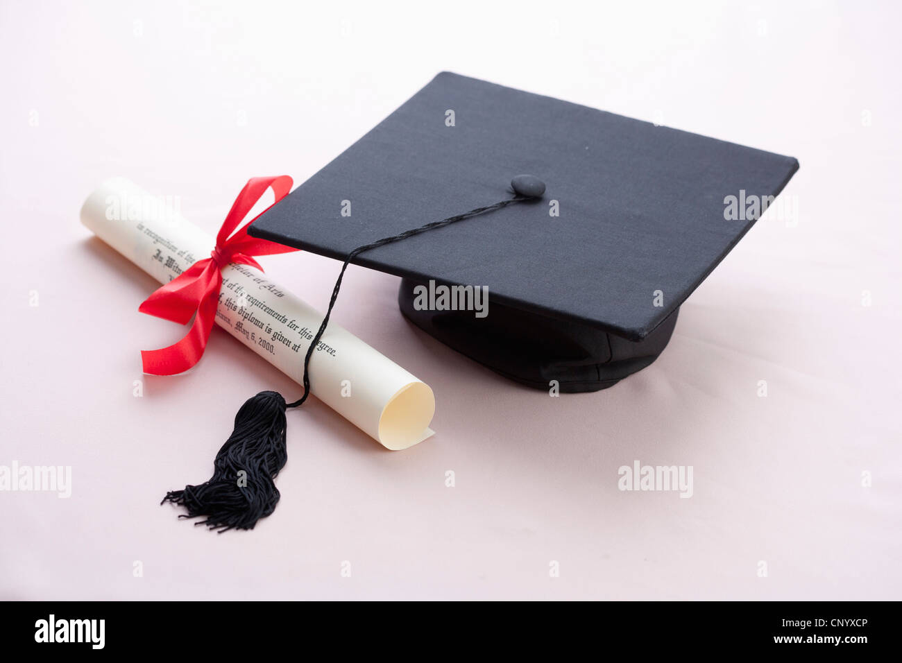 The graduation cap and the diploma Stock Photo - Alamy