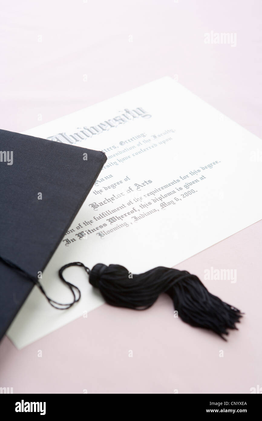 The graduation cap and the diploma Stock Photo - Alamy