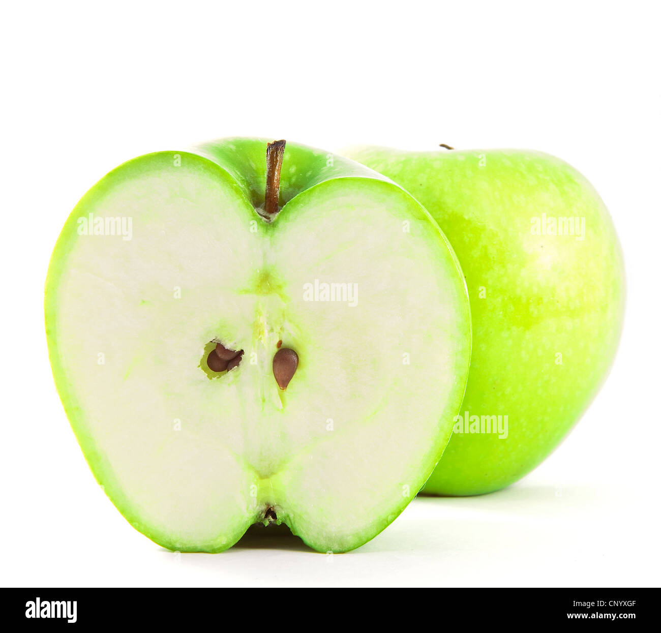 Green apple and half of apple on white background Stock Photo - Alamy