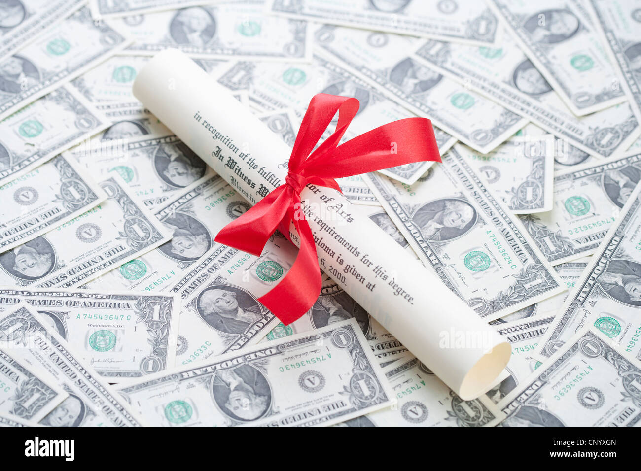 The diploma on the money Stock Photo - Alamy
