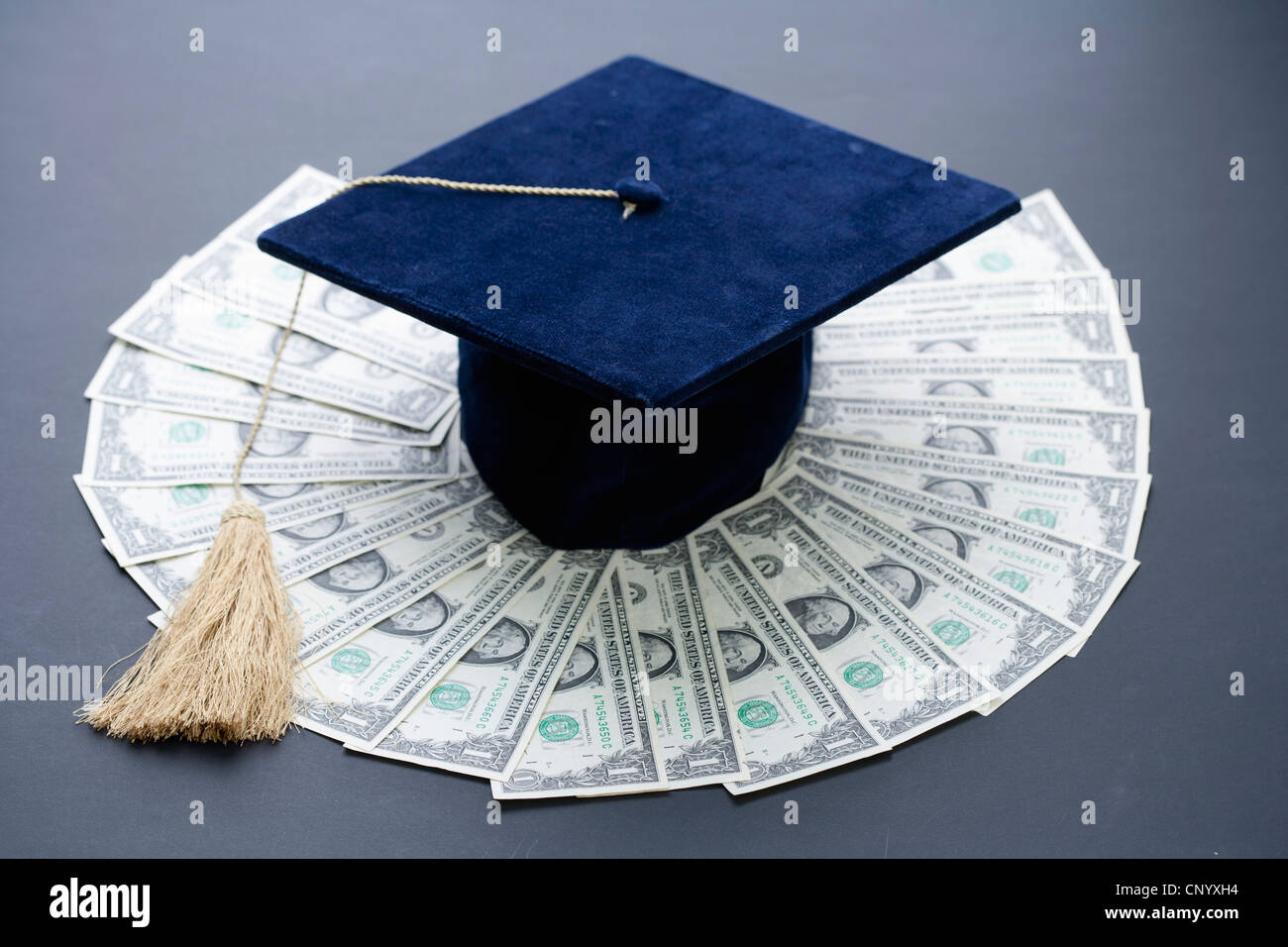 The graduation cap on the money Stock Photo - Alamy