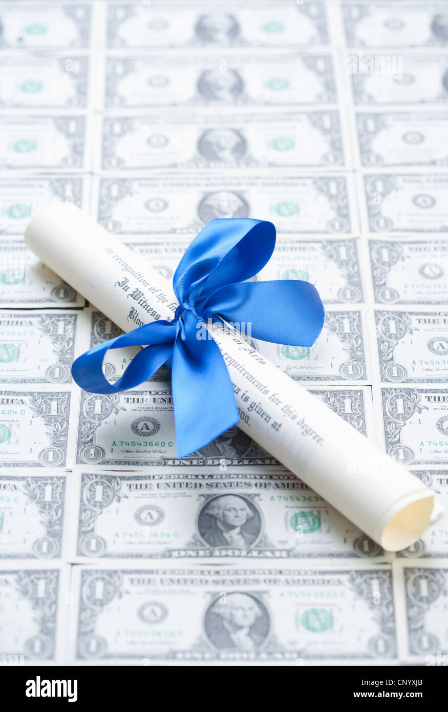 The diploma on the money Stock Photo - Alamy