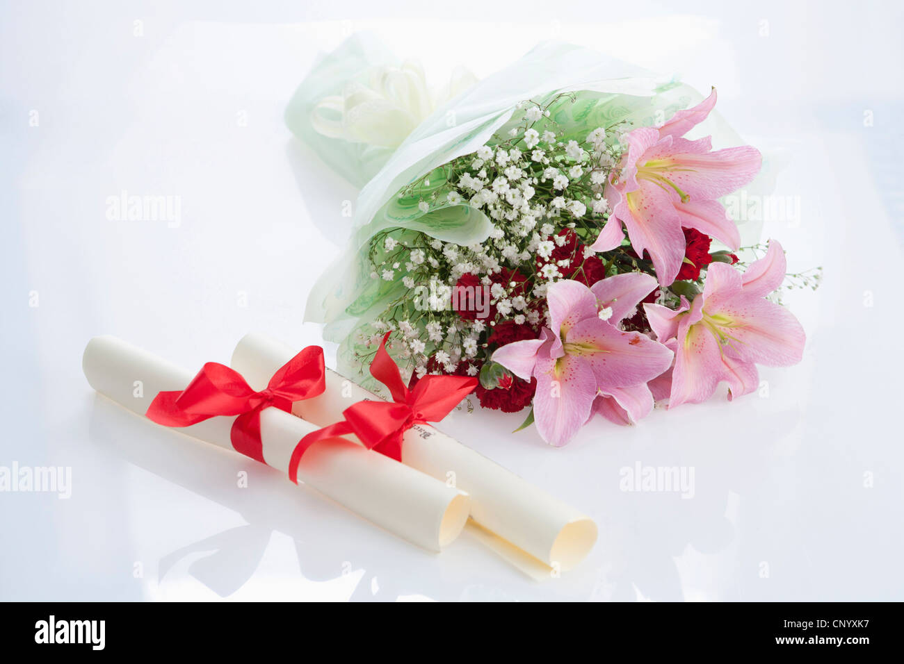 The diploma and the bouquet of flower Stock Photo - Alamy