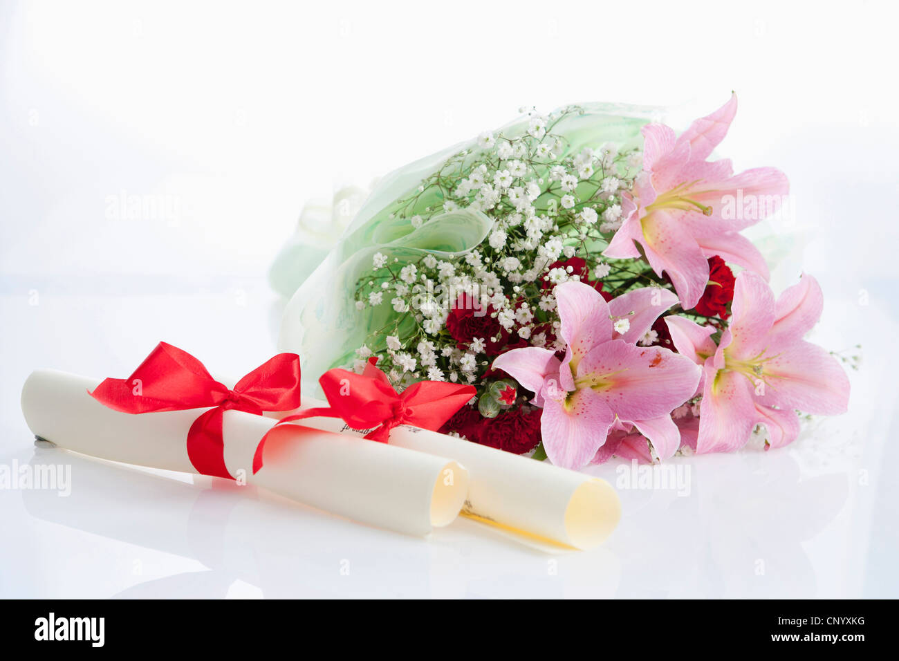 The diploma and the bouquet of flower Stock Photo - Alamy