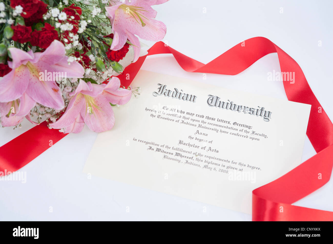 The diploma and the bouquet of flower Stock Photo - Alamy