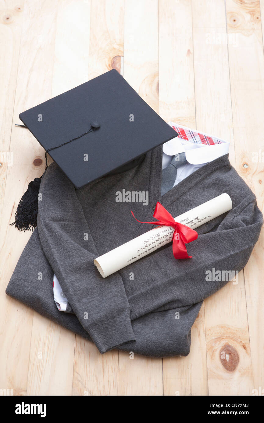 The graduation cap, school uniform, and diploma Stock Photo - Alamy