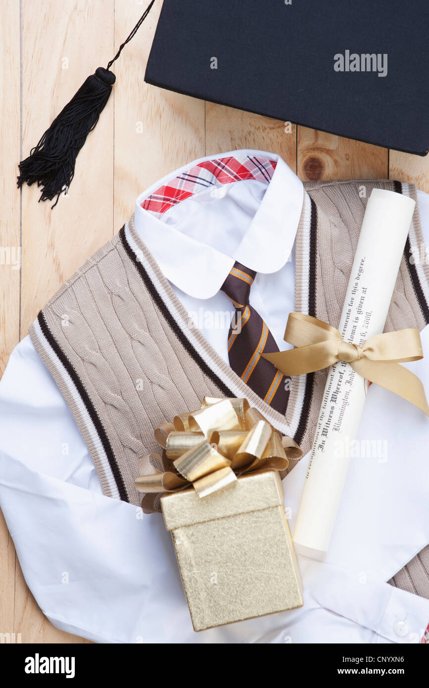 The graduation cap, school uniform, gift, and diploma Stock Photo - Alamy