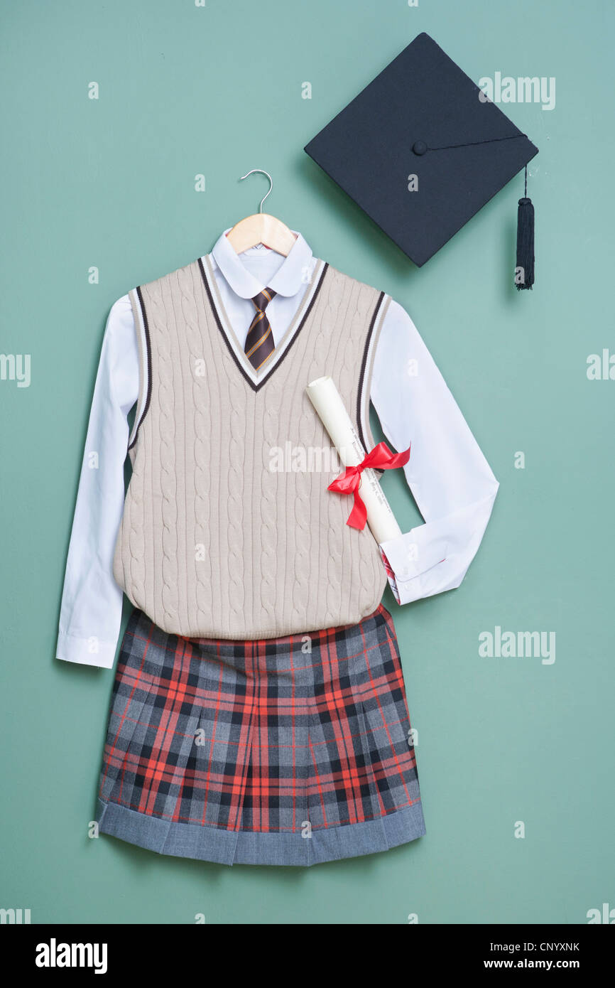 The graduation cap, school uniform, and diploma Stock Photo - Alamy