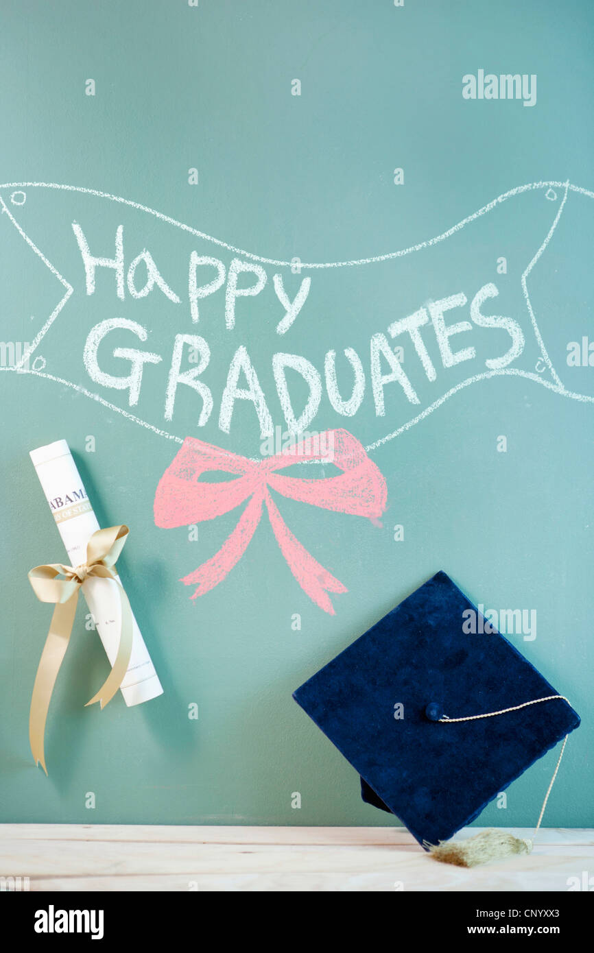 The graduation cap, diploma, and celebrating word Stock Photo - Alamy