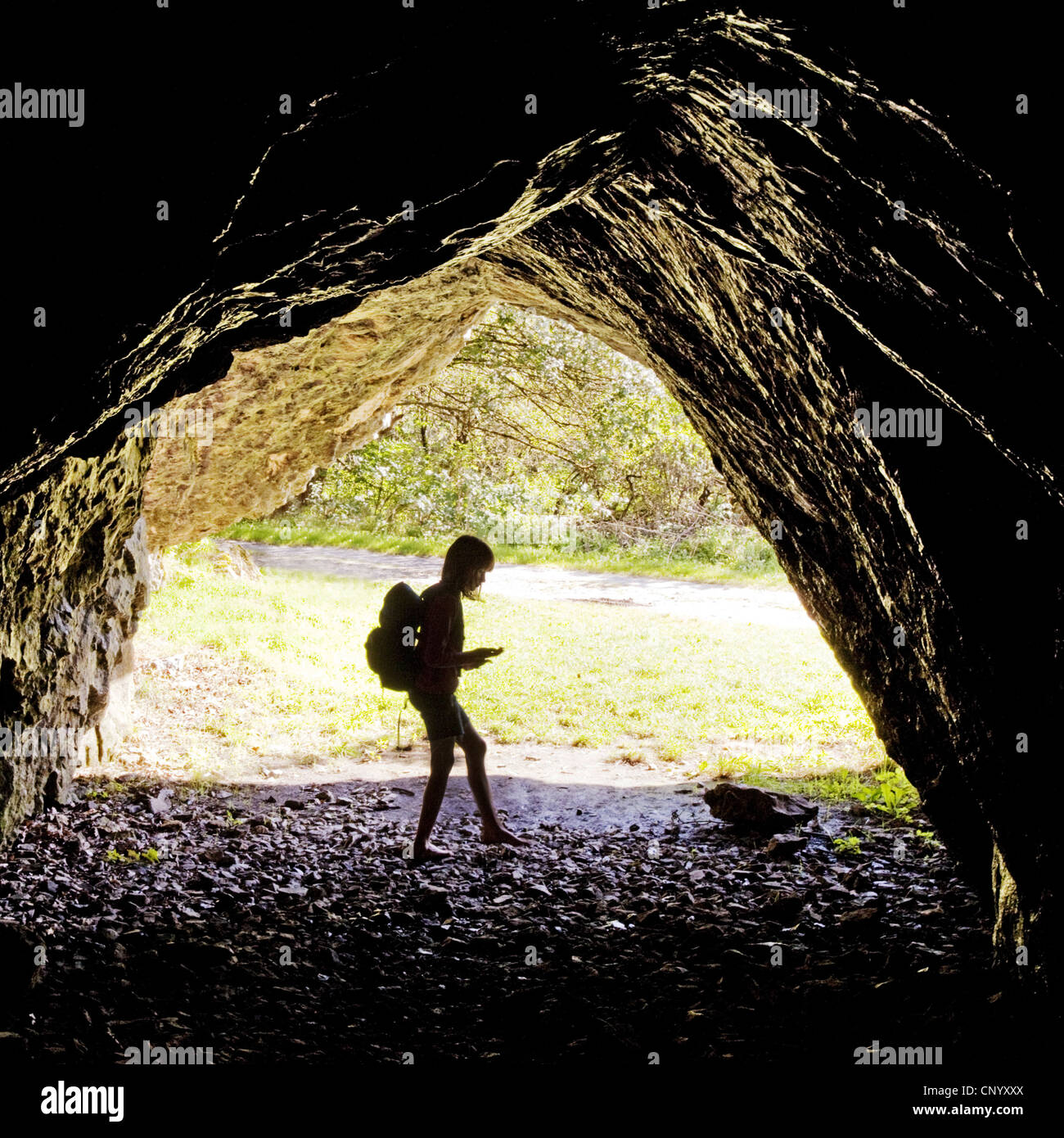 girl in the cave 'Hohler Stein', Germany, North Rhine-Westphalia ...