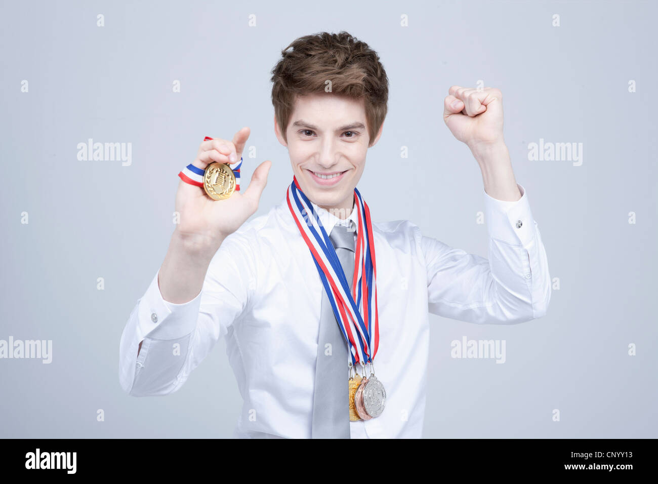 A man holding the prize medal Stock Photo - Alamy