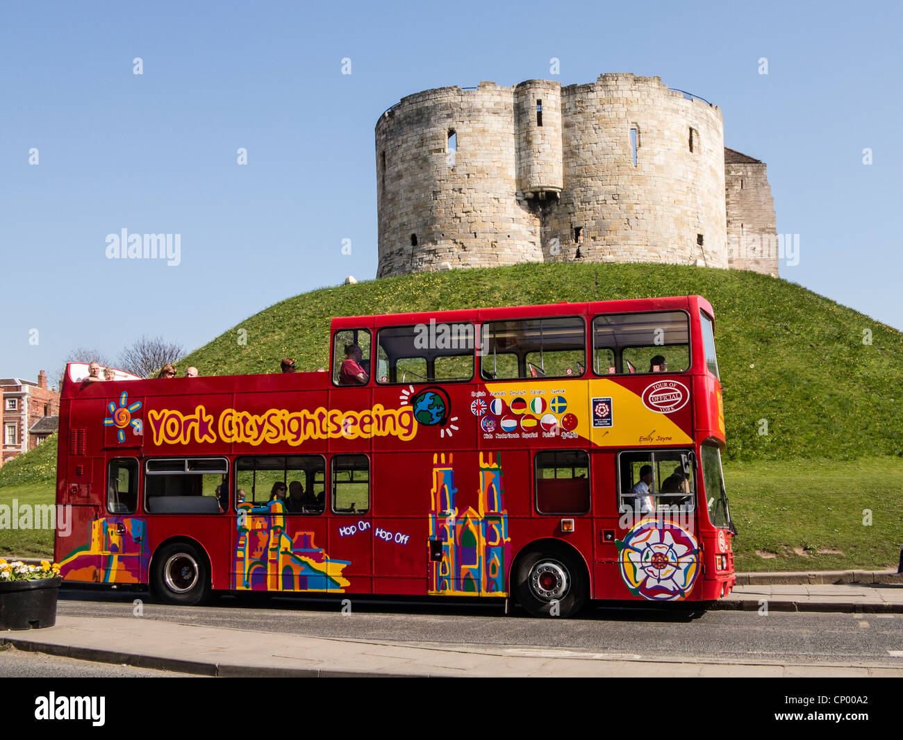 Tour bus below Cliffords Tower York UK Stock Photo - Alamy