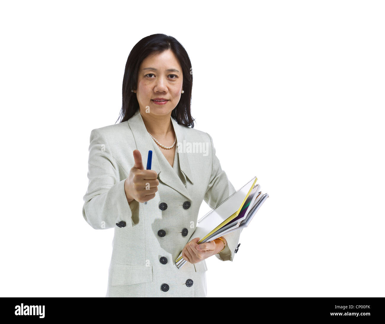 Asian woman dressed in business formal white suit giving thumbs up sign ...
