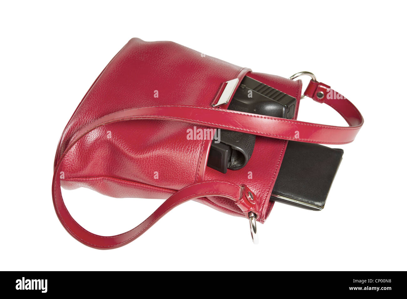Personal weapon in red purse on white background Stock Photo - Alamy