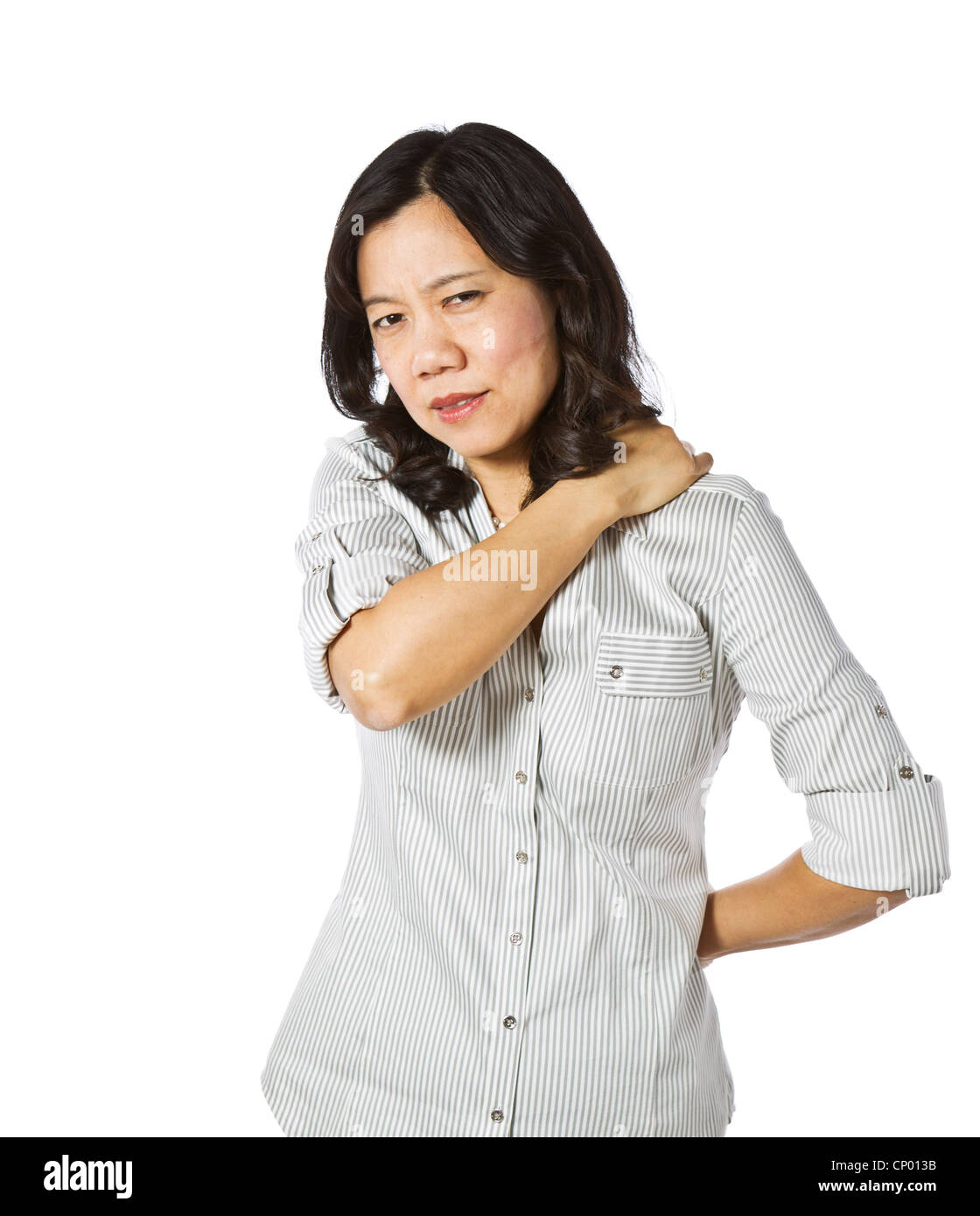 Asian lady touching her shoulder and back on white background Stock ...