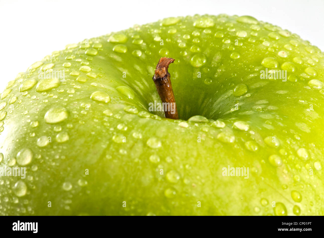 Green apple with water drops as background Stock Photo - Alamy