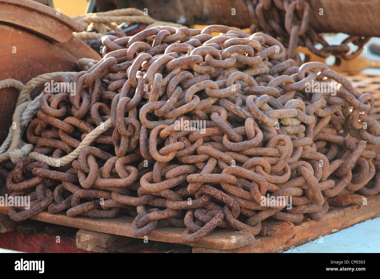 A pile of chain on the deck of a boat Stock Photo - Alamy