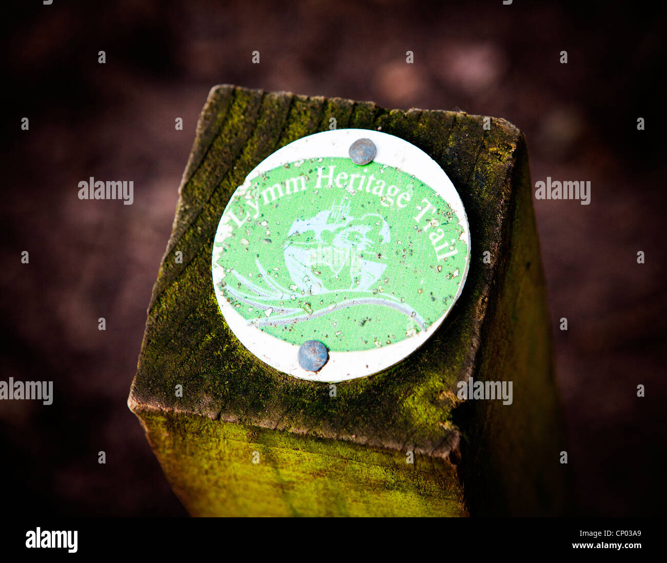 Lymm Heritage Trail sign nailed to the top of a wooden post Stock Photo ...