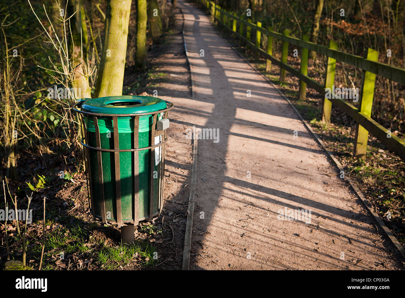 Footpath with strong shadows across it and rubbish / poop bin at Lymm ...