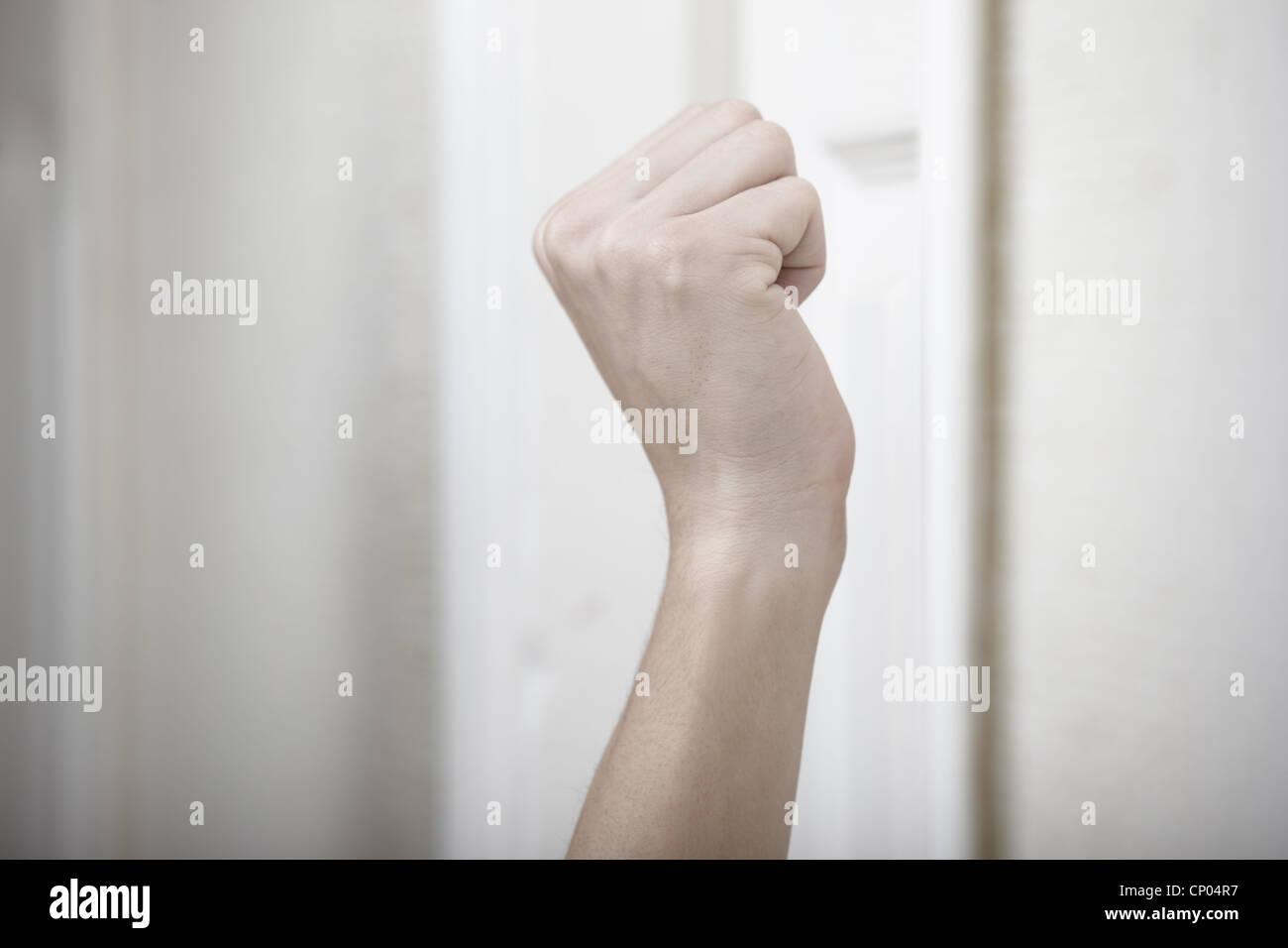 Human hand knocking at the wooden door Stock Photo - Alamy