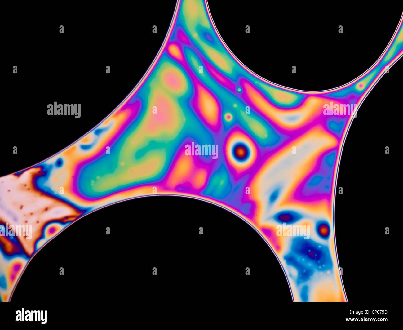 thin soapy film, tenside solution with interference colors Stock Photo ...