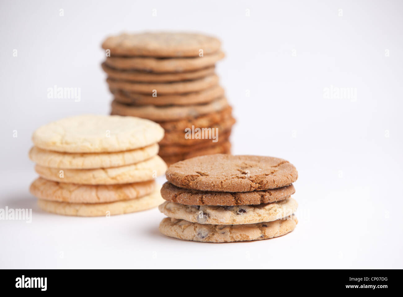 Assorted cookies stacked in the studio Stock Photo - Alamy