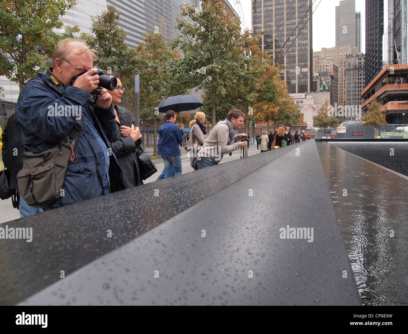 Tourists visiting the 9/11 Memorial in New York City, New York, USA ...