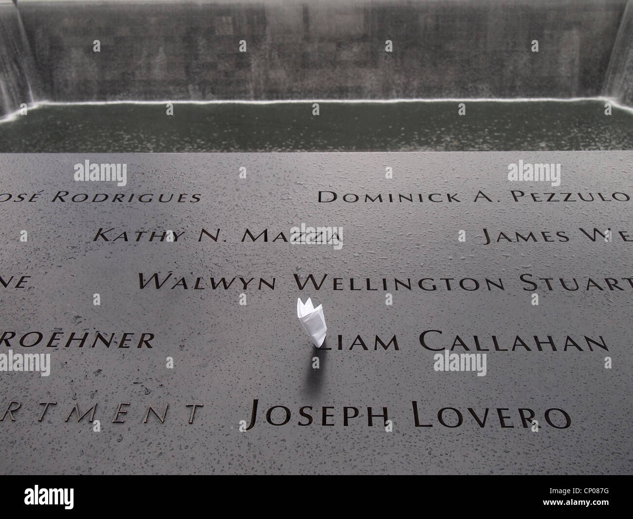 A note is placed at the name of a victim at the 9/11 Memorial in New ...