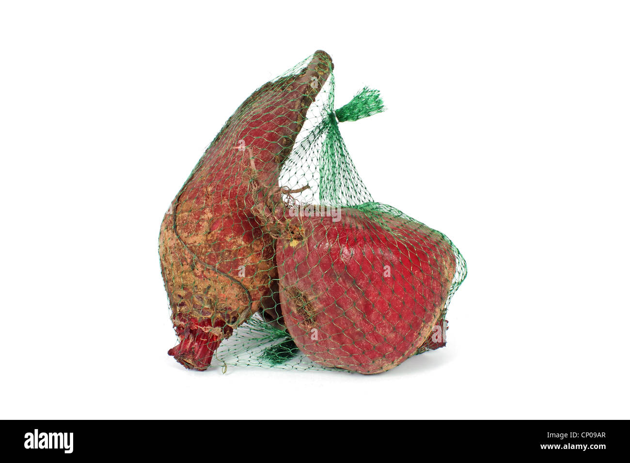 Red beet in plastic net isolated on white Stock Photo - Alamy