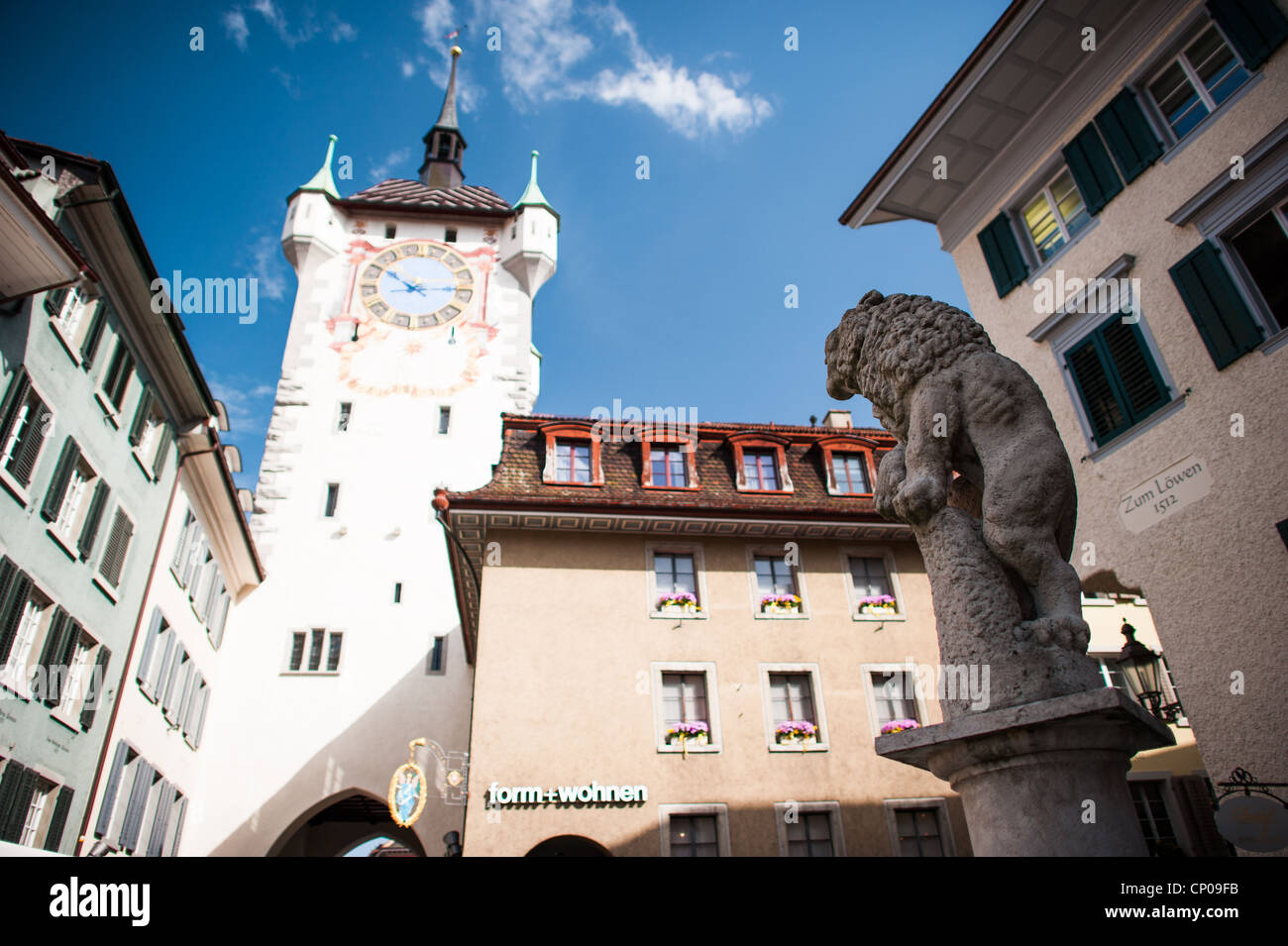 City tower of Baden, Aargau, Switzerland. Focus is on the lion statue ...