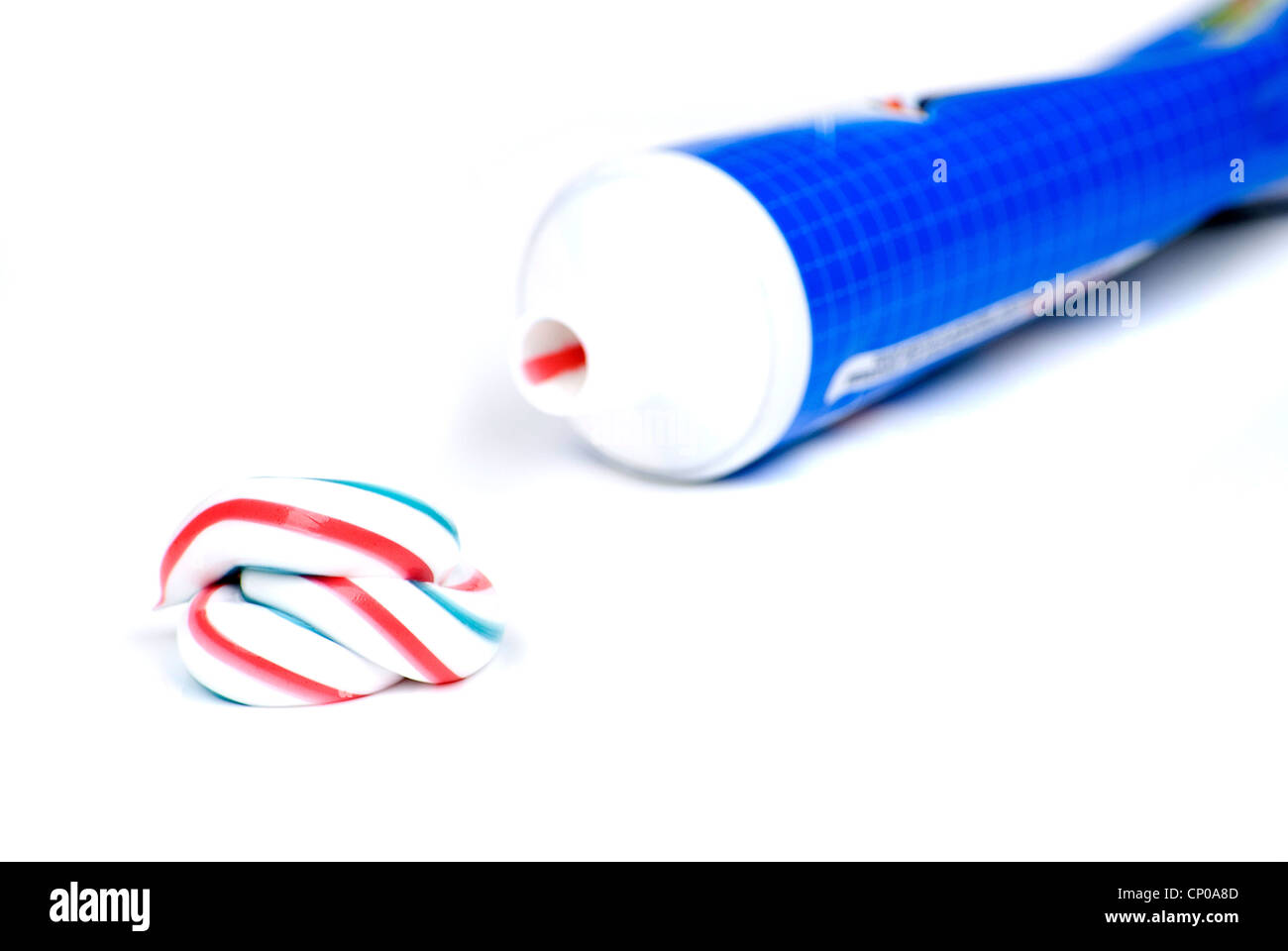 white red and blue squeezed toothpaste isolated on a white background ...