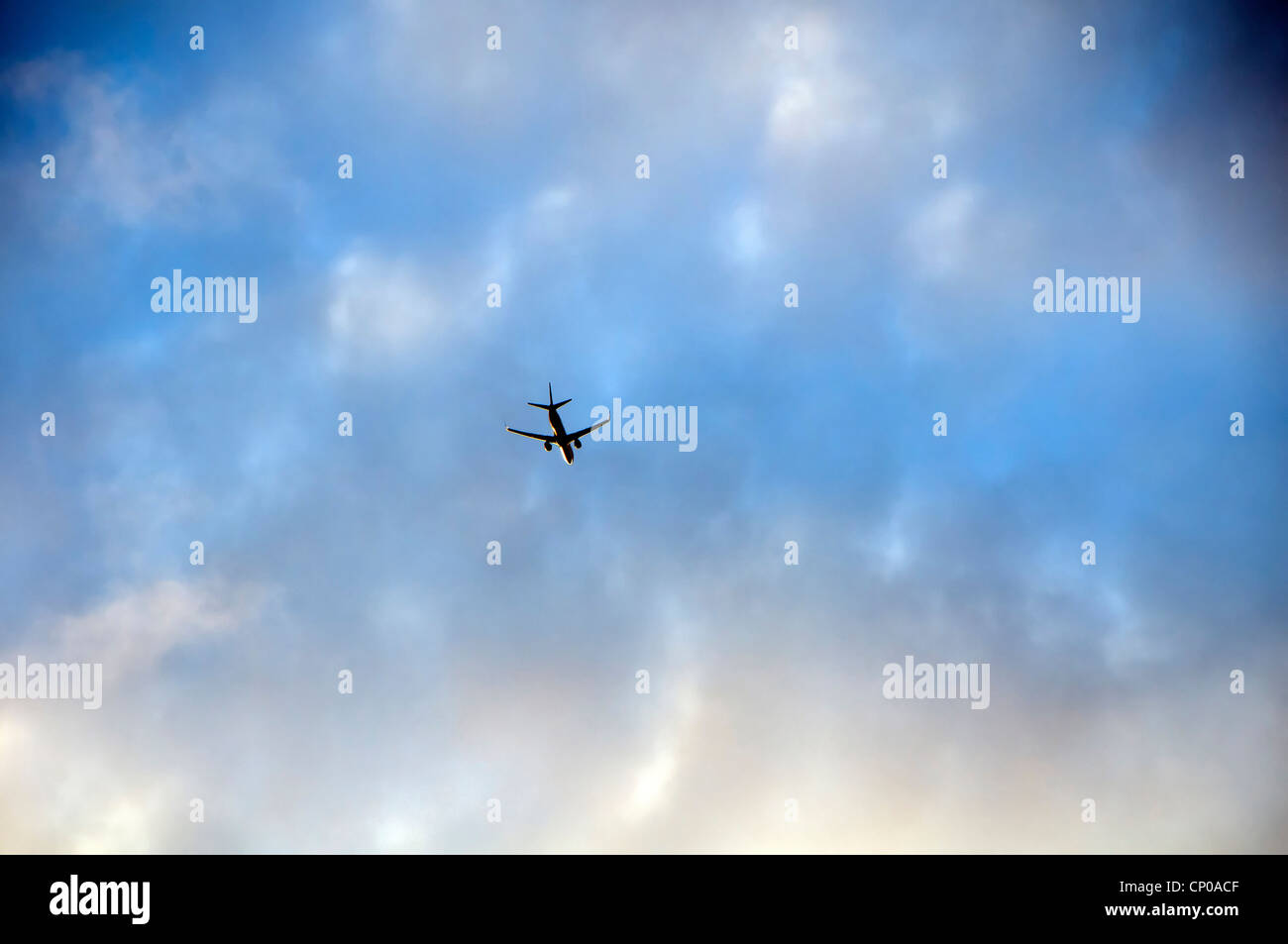 Airliner flying high Stock Photo - Alamy