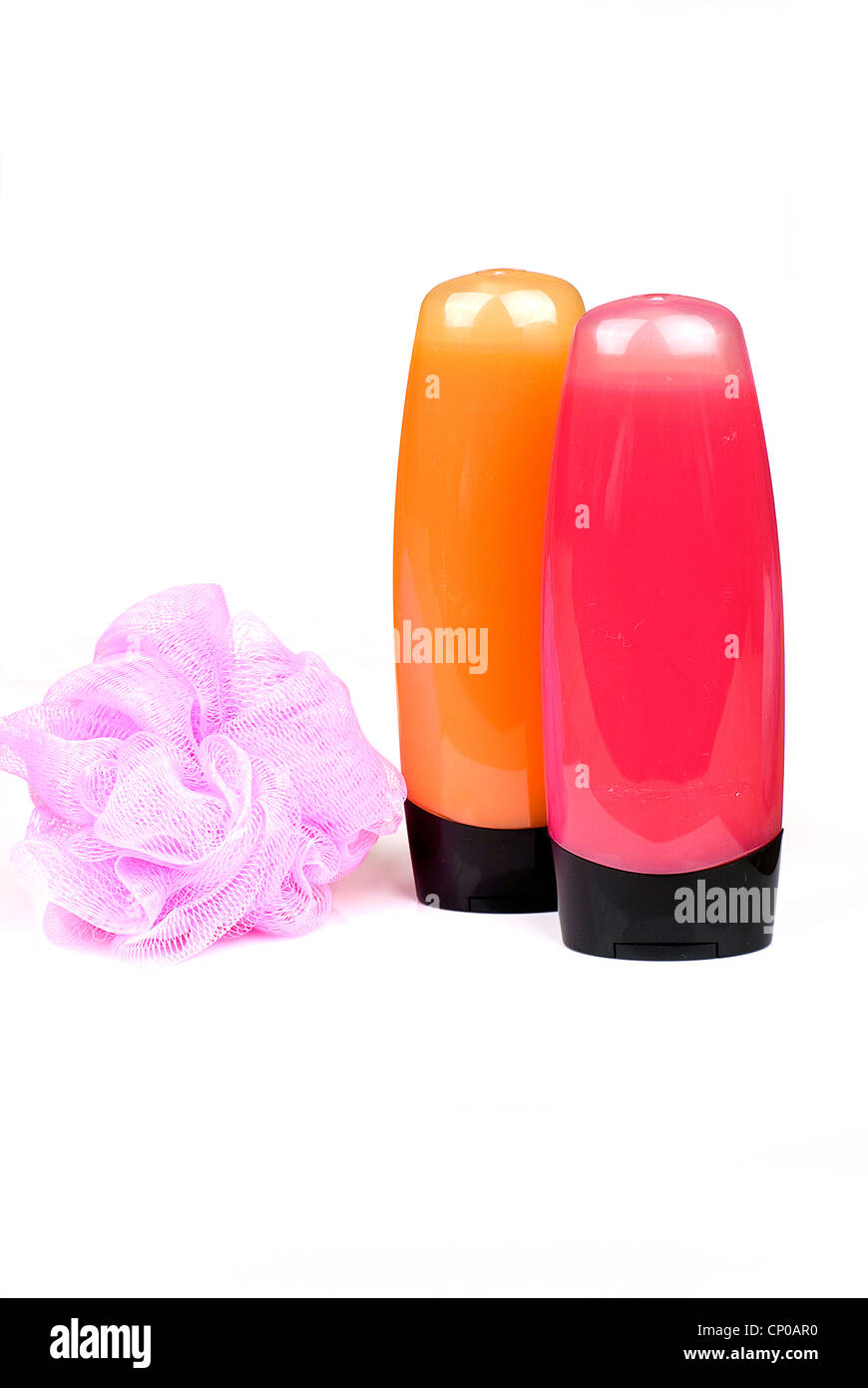 red and orange colored shower gel bottles and sponge isolated on white ...