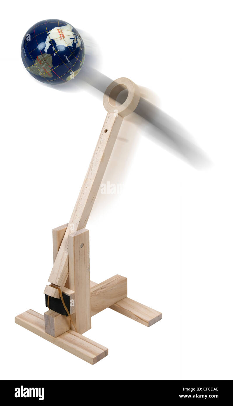 The world being thrown by a wooden catapult during a war - path ...