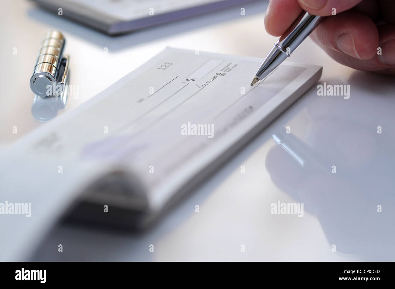 Prepare writing a check Stock Photo - Alamy