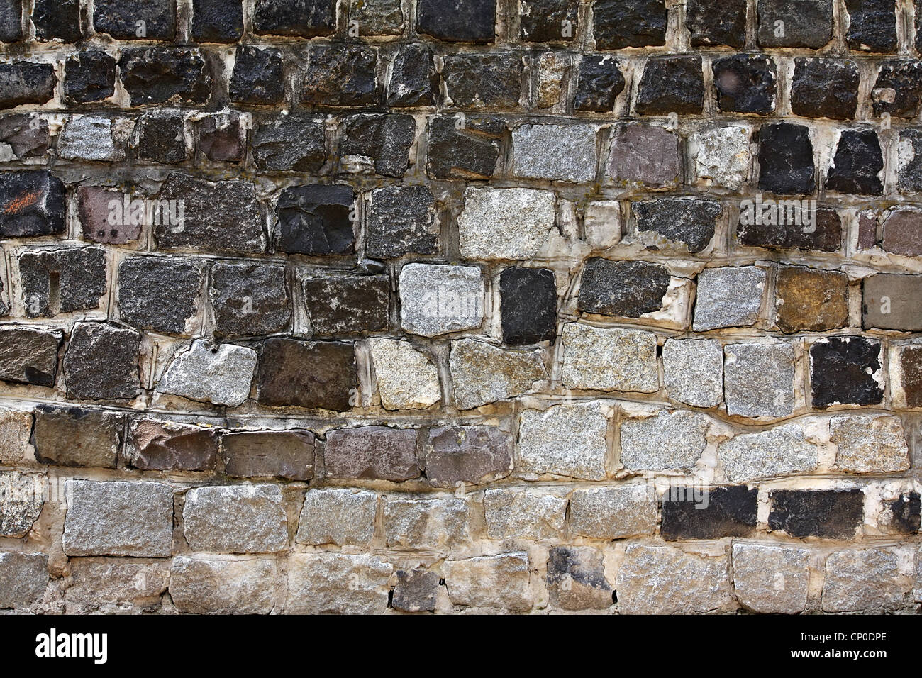 Old styled wall made from different stone blocks Stock Photo - Alamy