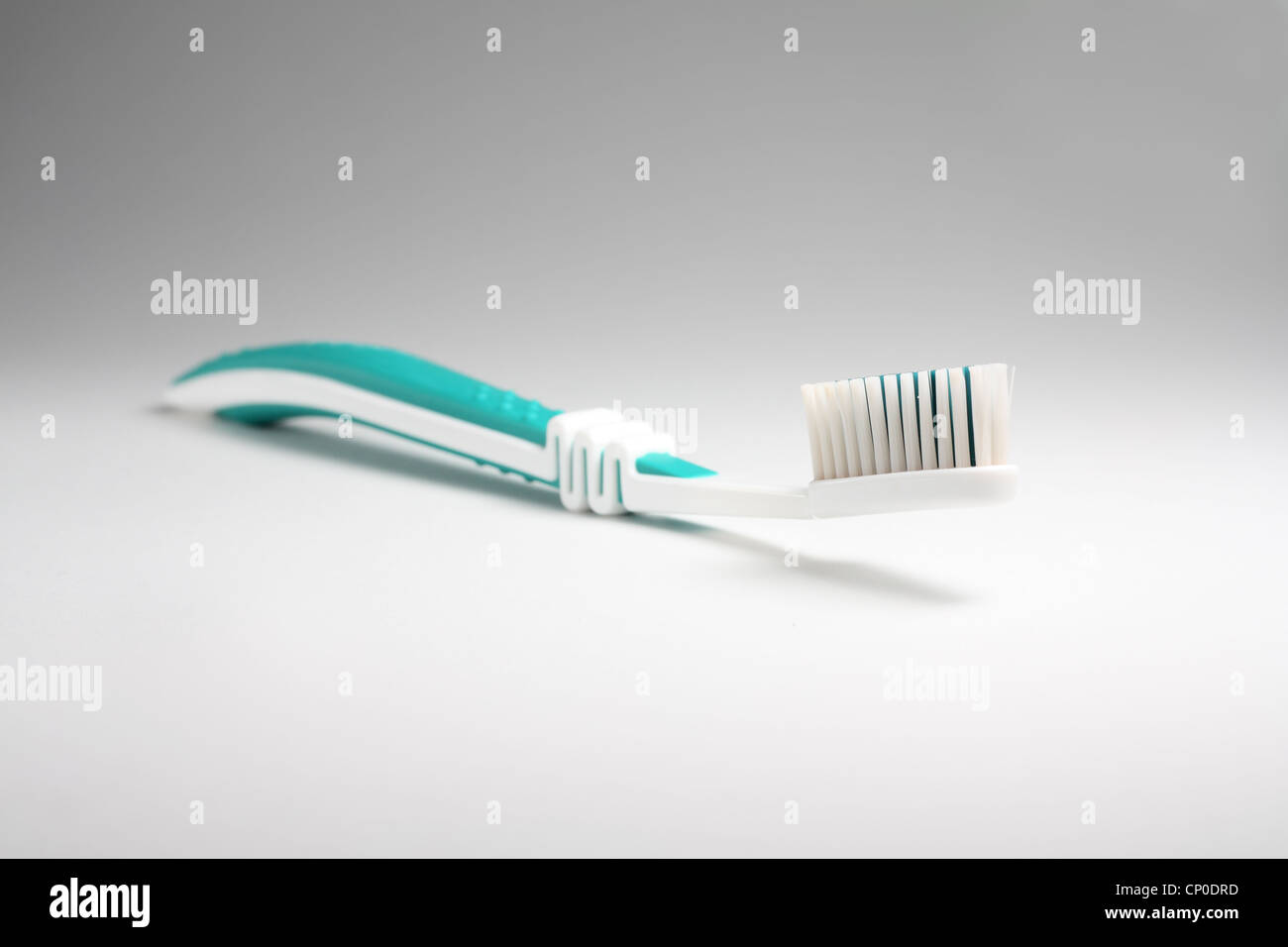Toothbrush without paste at light background Stock Photo - Alamy