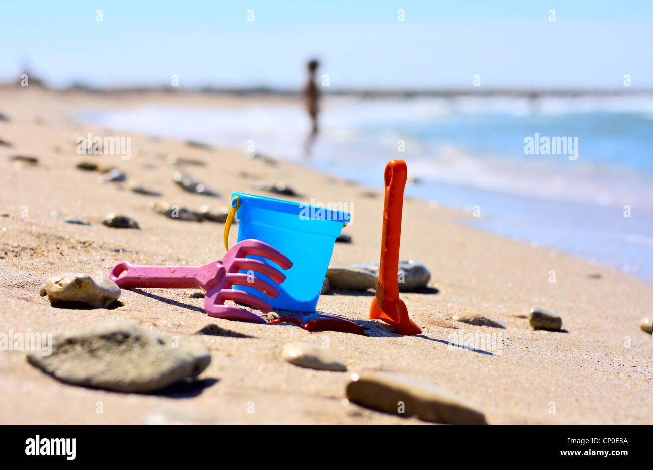Plastic bucket on the beach near the sea Stock Photo - Alamy