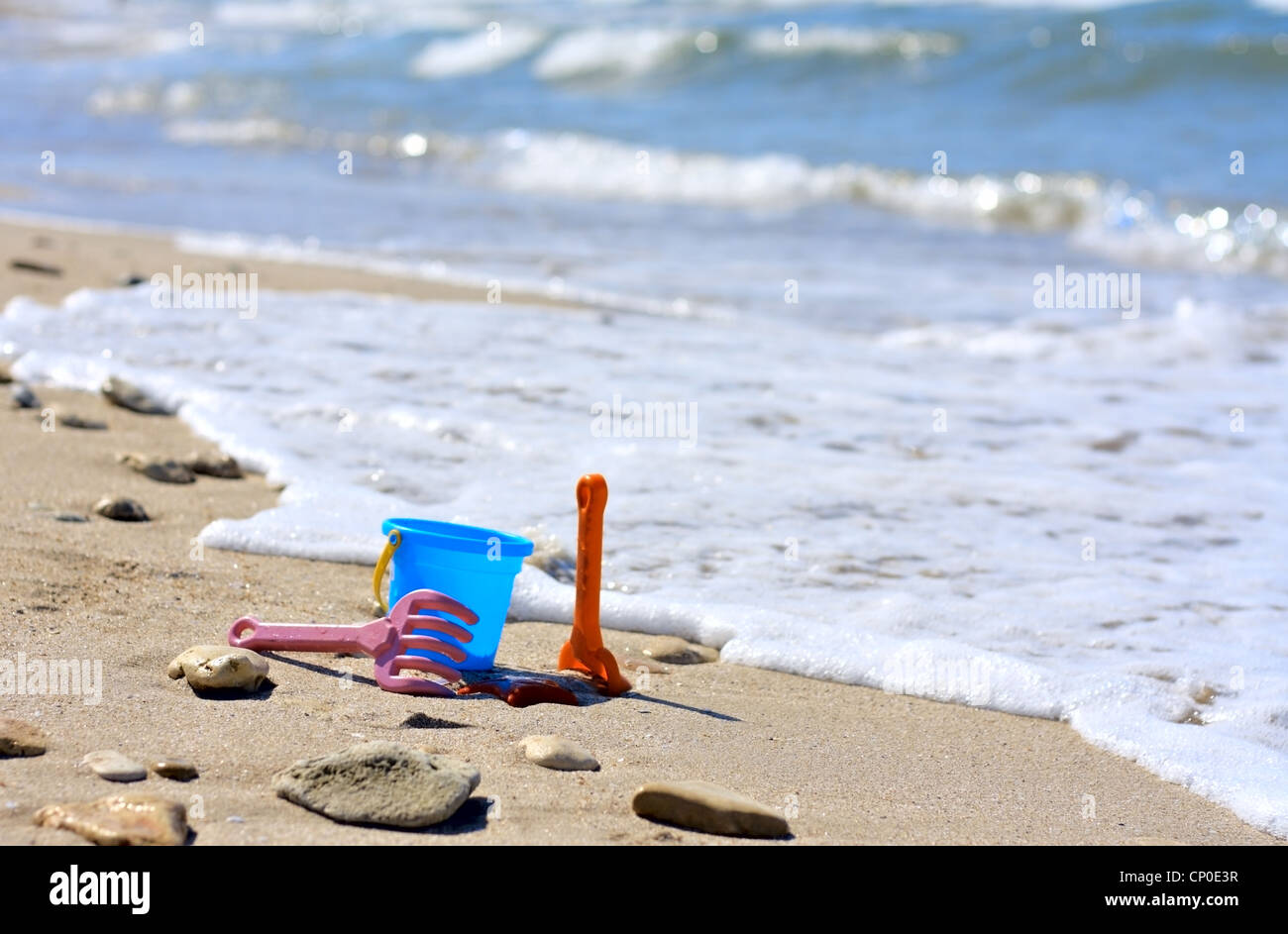 Plastic bucket on the beach near the sea Stock Photo - Alamy