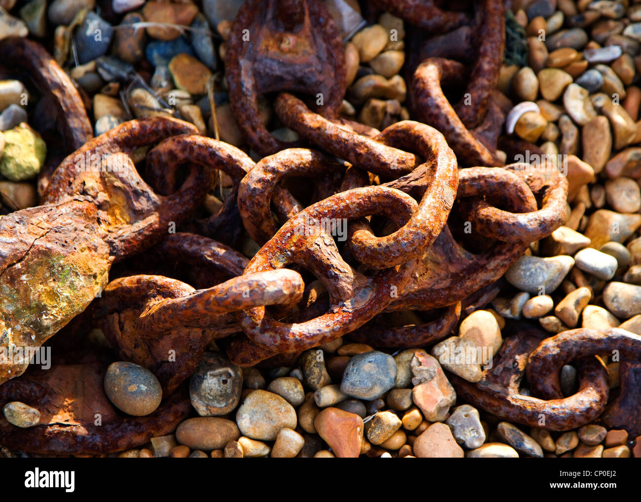 Rusty Ship Chains on a Pebble Beach Stock Photo - Alamy