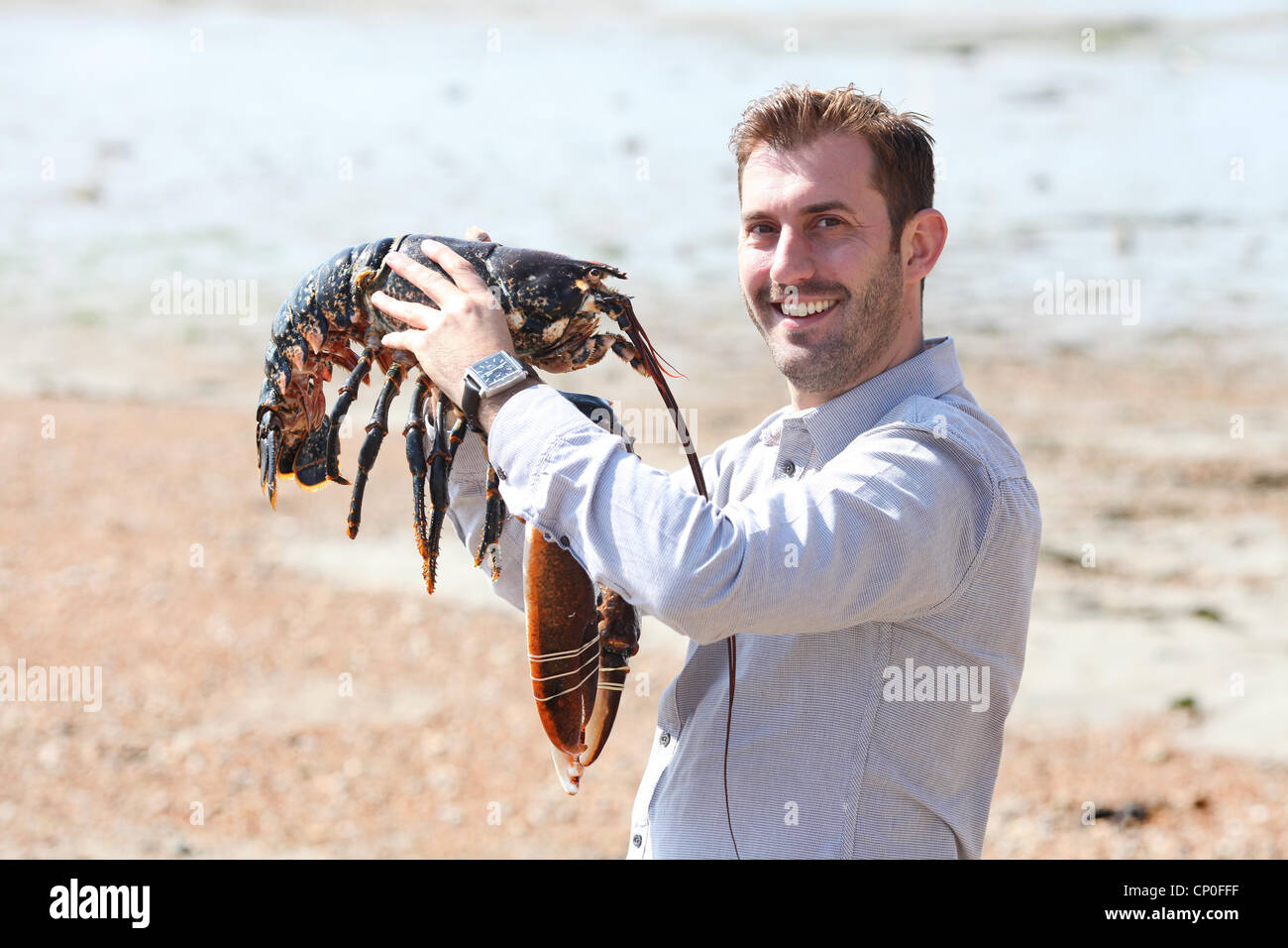 British chef Mark Sargent holding a large lobster caught that off ...