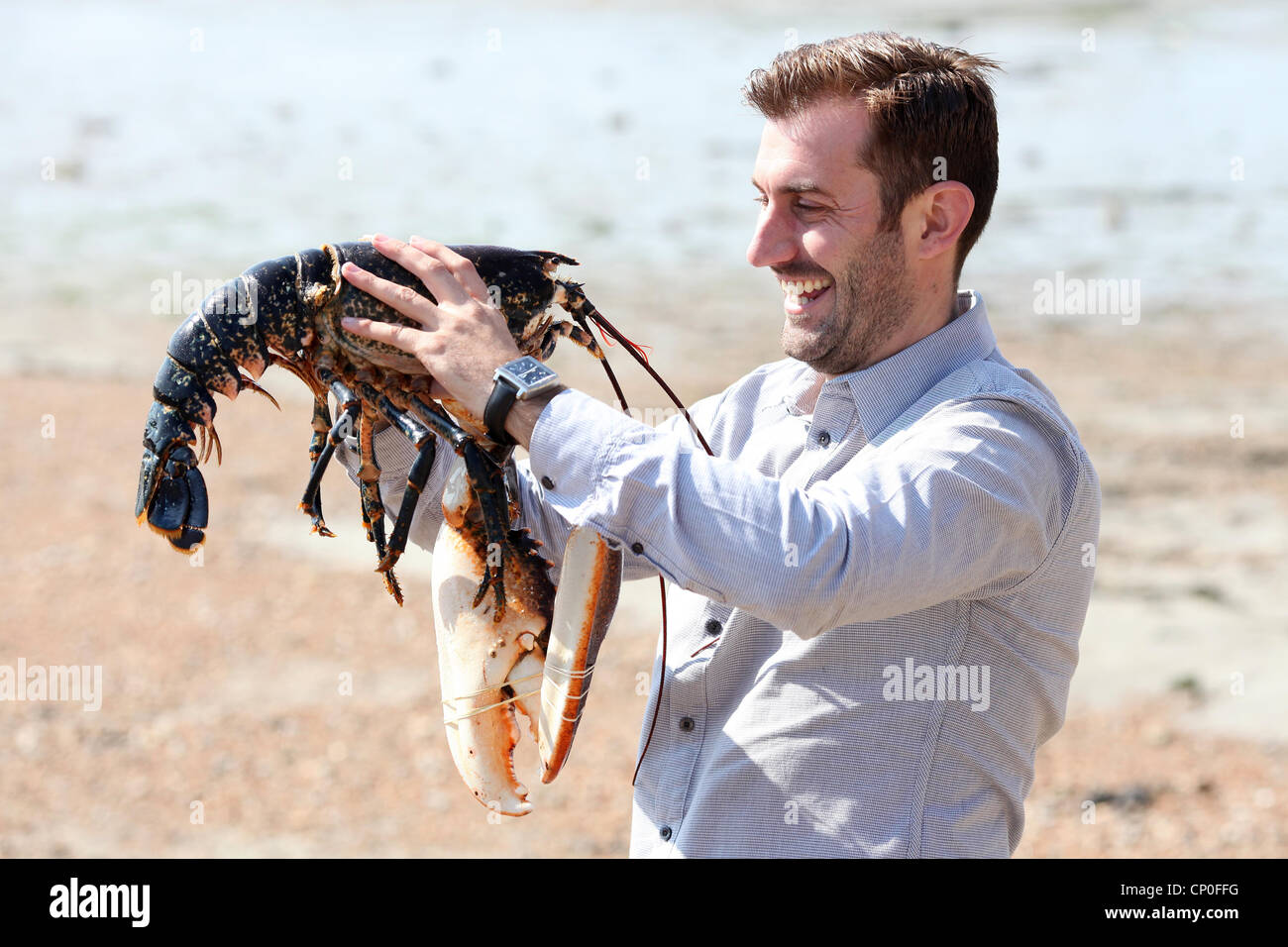 British chef Mark Sargent holding a large lobster caught that off ...